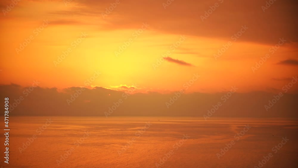 Sea surface small waves against of golden sunrise of sun slow motion ...