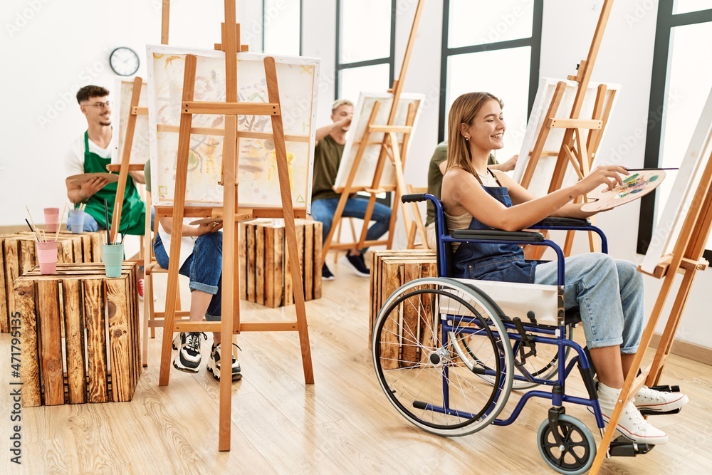 Group of people drawing at art studio. Young woman sitting on ...
