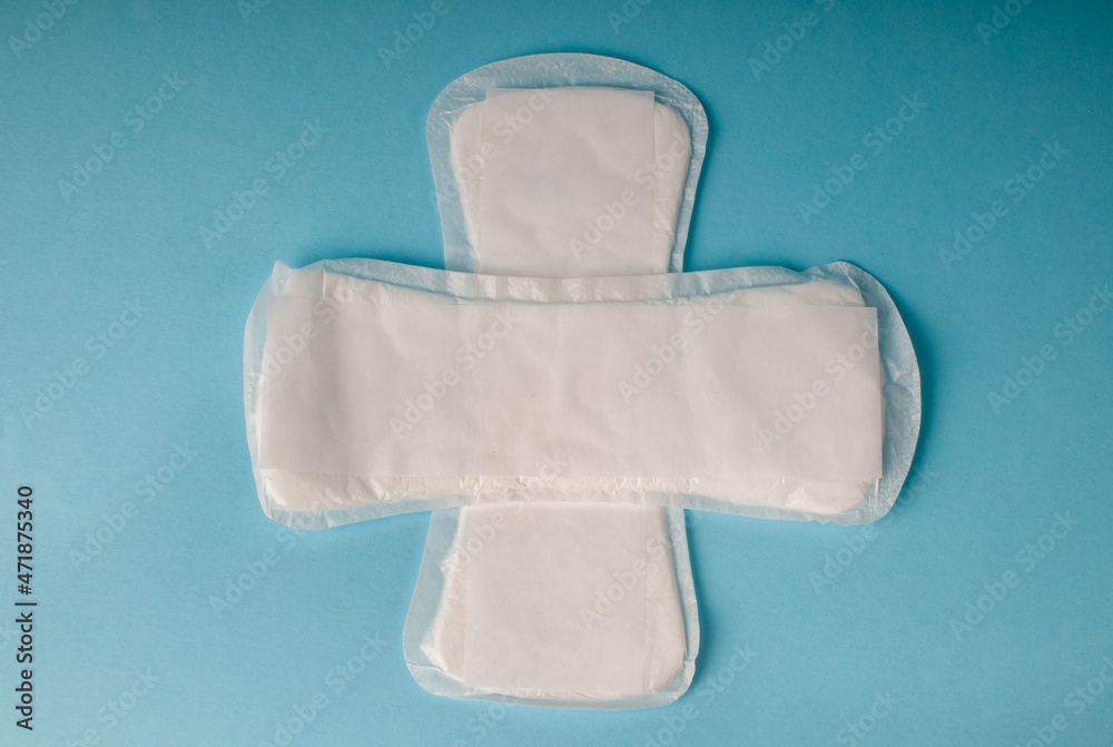Feminine hygiene pads for the menstrual cycle on a blue background ...