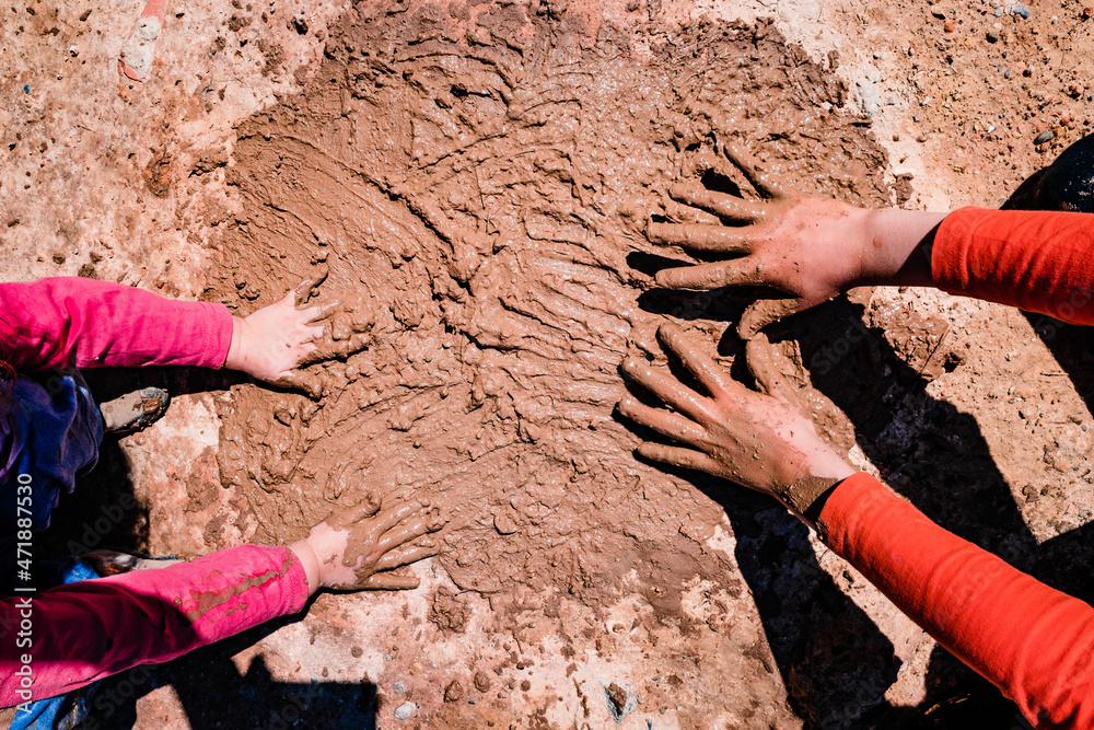 Children play mud outside without worrying about hygiene and microbes ...