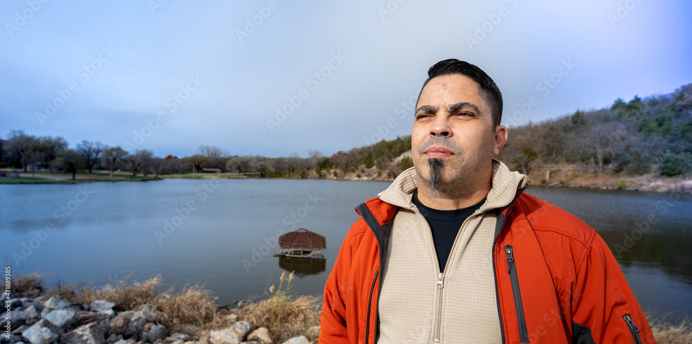 Adventure man hiking and walking in the walking in the woods and lake ...