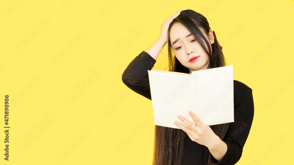 Stressed student. Exam preparing. Study overload. School problem. Sad worried teen girl reading ...