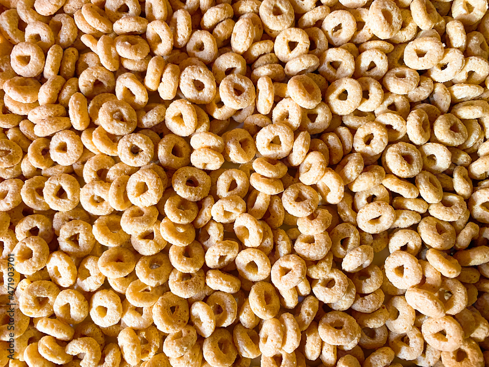 Huge pile of breakfast cereal food round hoops on the kitchen counter ...
