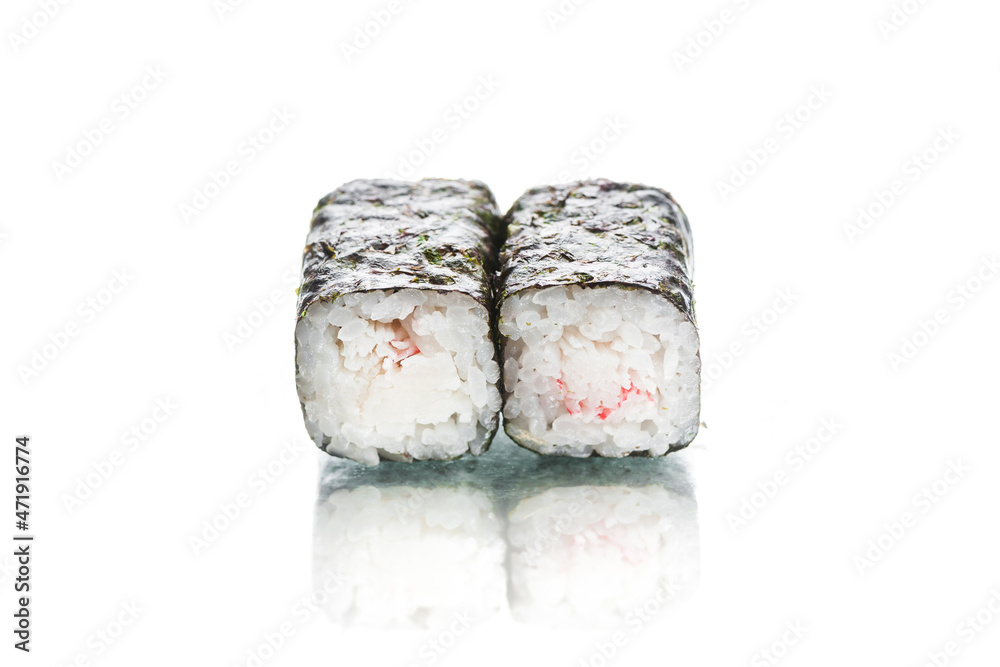 Two pieces of Japanese Maki sushi roll with nori seaweed on top. Crab ...