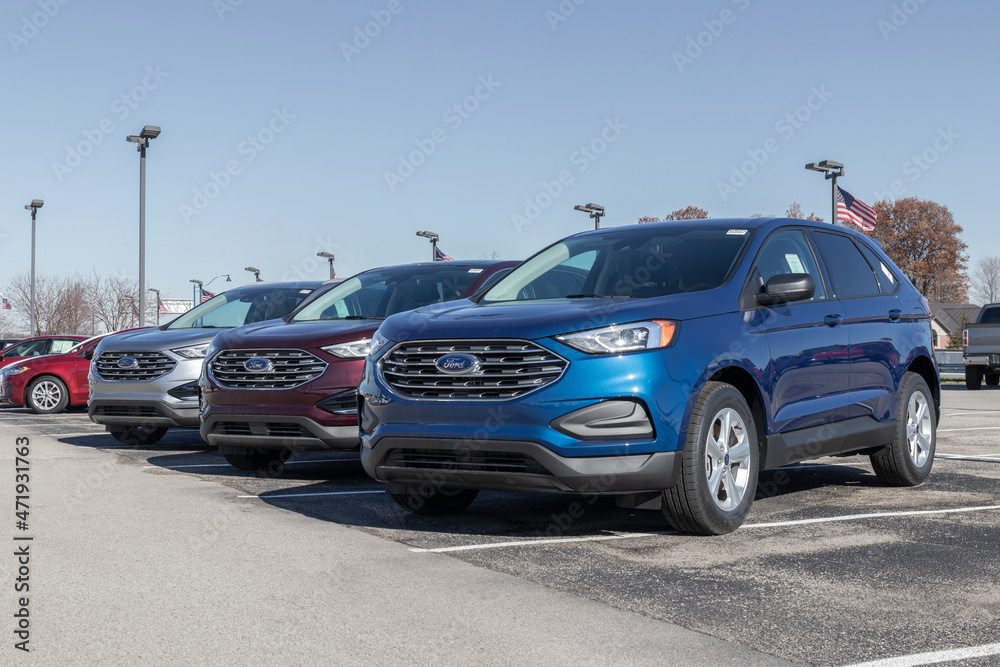 Ford Edge SUV display at a dealership. Ford sells traditional gasoline ...