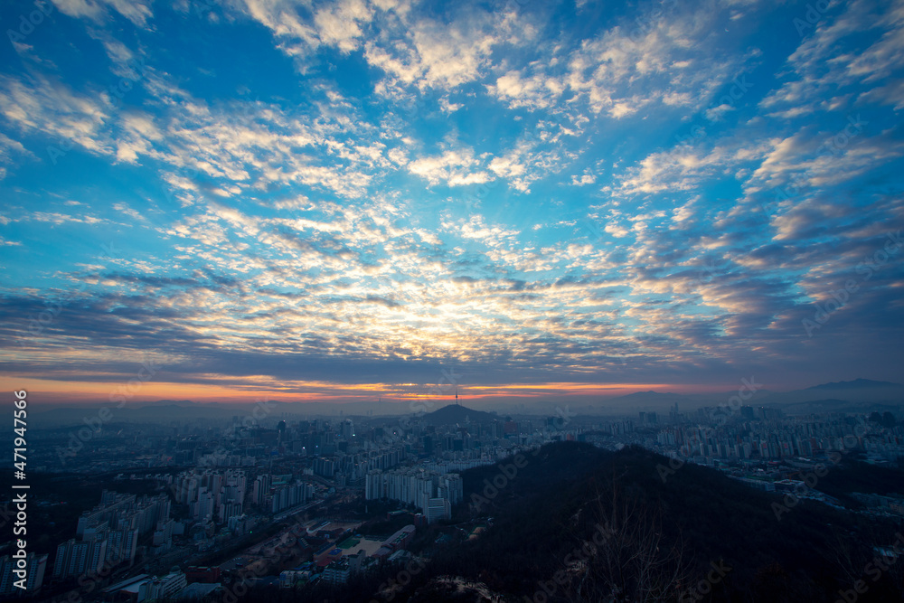 Sunrise behind Seoul Tower in Korea. Stock Photo | Adobe Stock