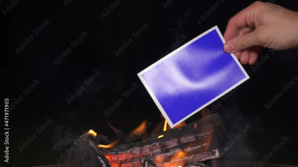 burn blue picture. place for your photo is on fire. throw photo in ...