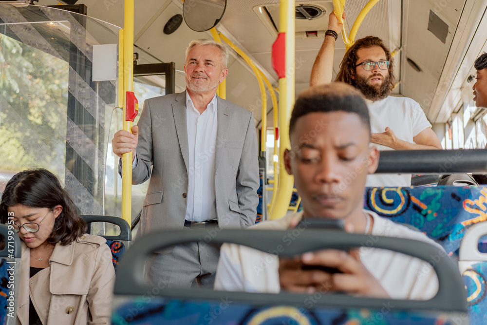 Crowd on public transport bus in afternoon traffic jams in city young ...
