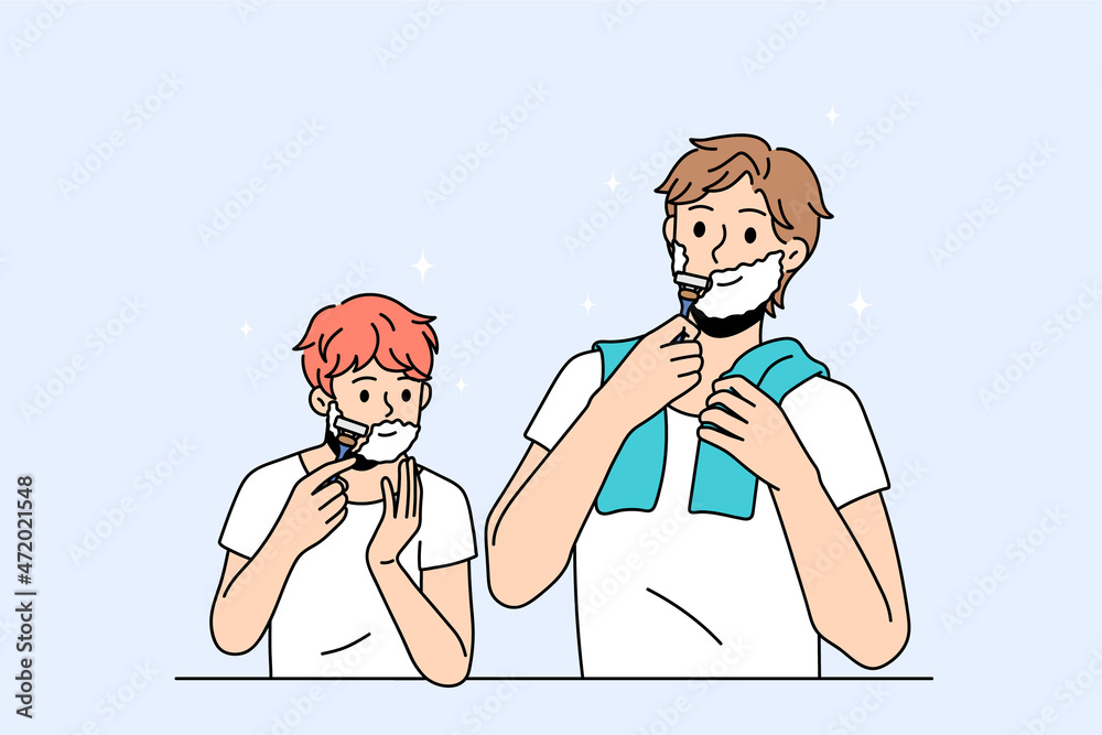 Happy caring young father teach teenage son shaving beard in home ...