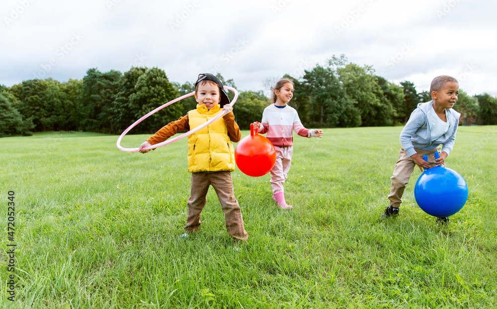childhood, leisure and people concept - group of happy children playing ...