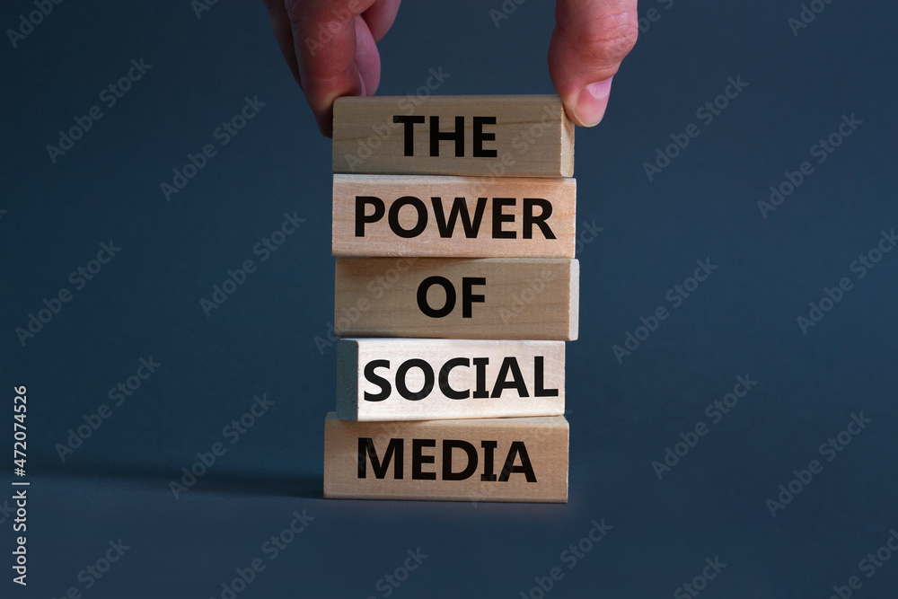Power of social media symbol. Wooden blocks with words The power of ...