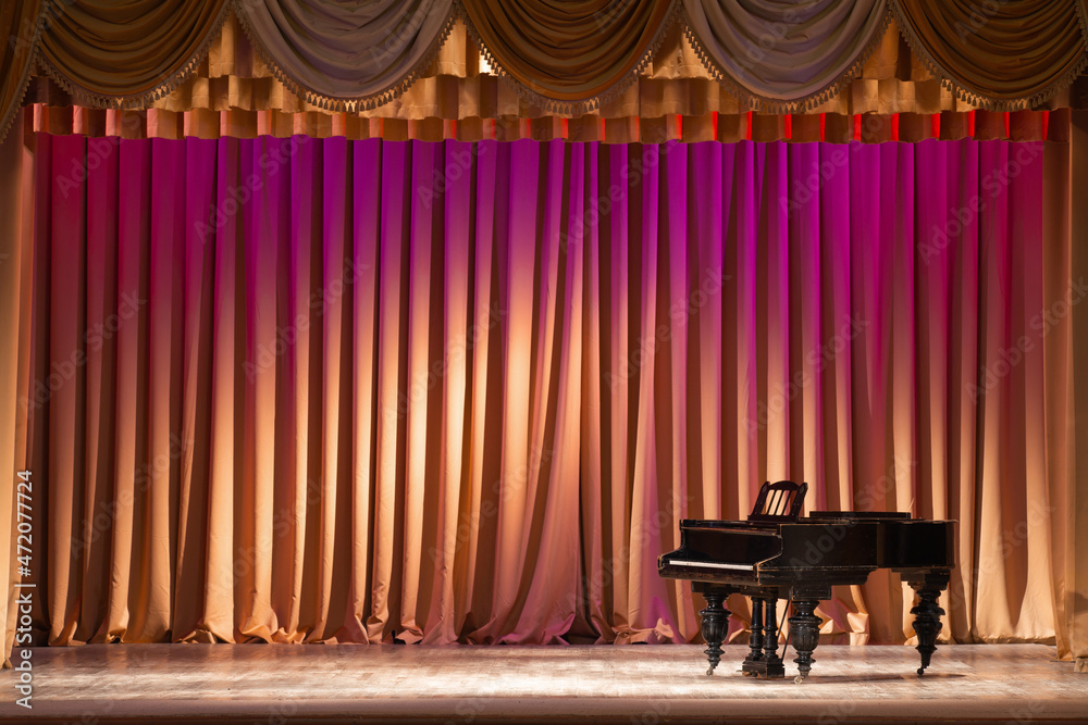 illuminated by lights stage with backstage and decorative columns ...