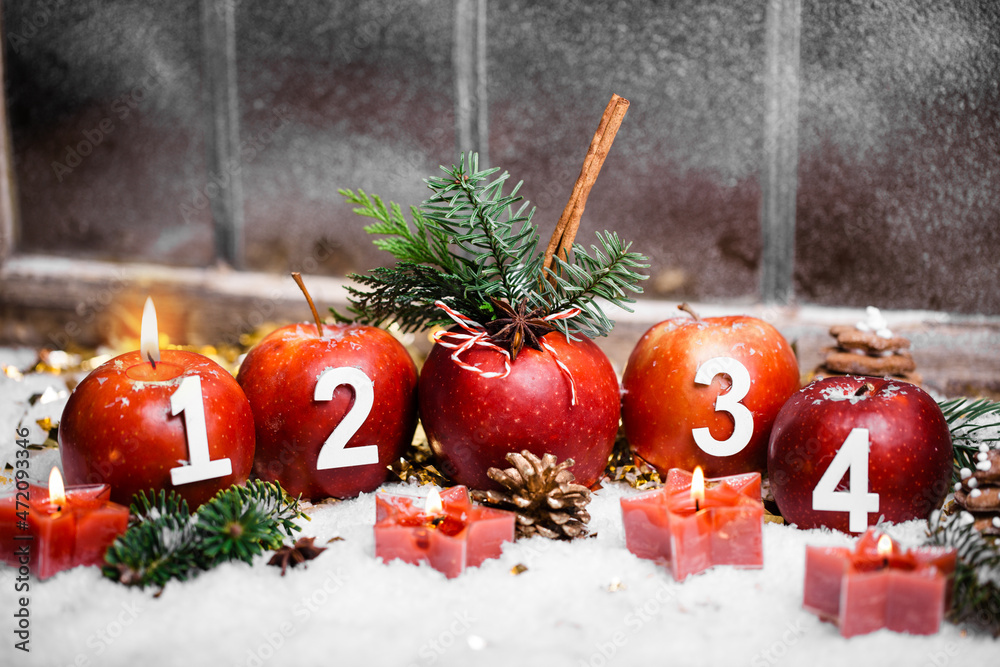 Beautiful card with advent candles and christmas apples in front of old ...