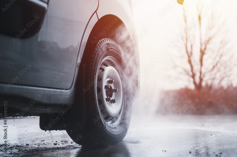 Car Wash detail. Vehicle During Washing Process. Manual washing wheels ...