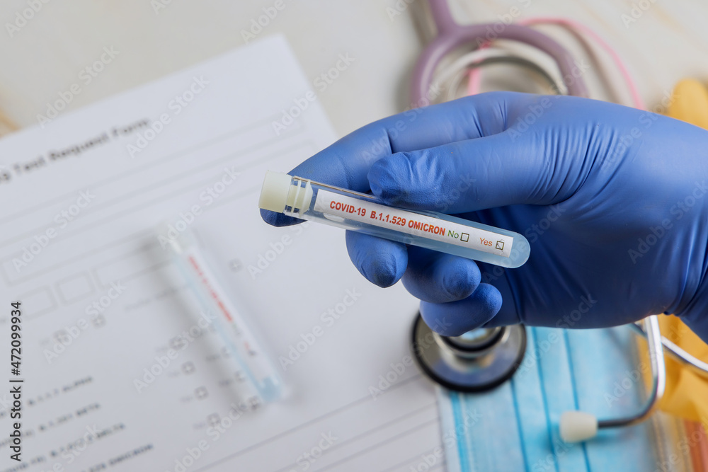 Tube containing a swab sample for COVID-19 that has tested positive of ...