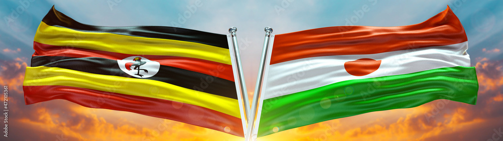 Uganda flag and Niger Flag waving with texture sky Cloud and sunset ...