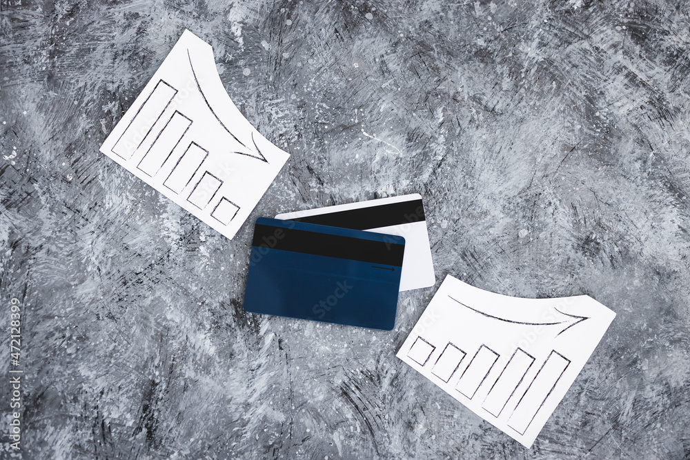 financial markets or money and investments, payment cards with charts ...