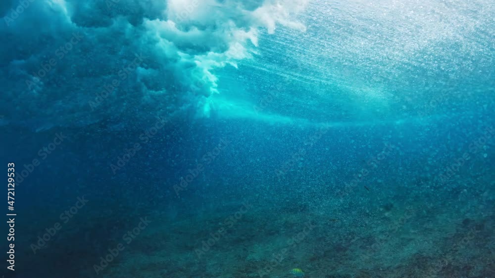 Ocean wave. Crystal clear ocean wave rolls and breaks. Underwater view ...