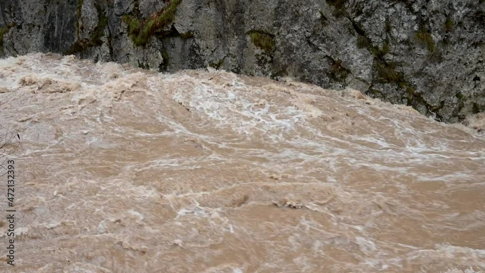 Water floods after heavy rain. Swollen river in autumn. Muddy and dirty ...