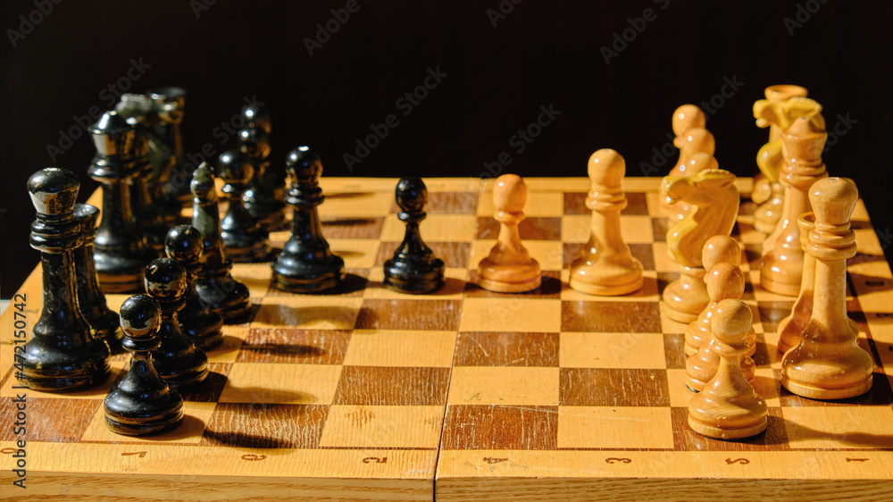 Playing old chess on a black background, retro board game Stock Photo ...