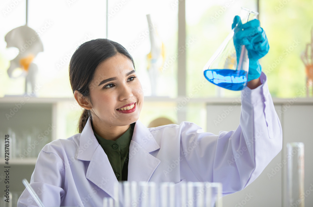Professional biology scientist enjoy analyzing blue chemical solution ... Professional biology scientist enjoy analyzing blue chemical solution ...