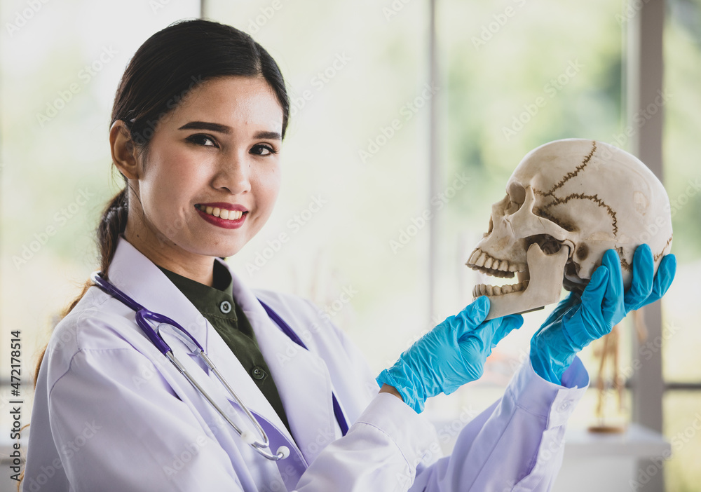 Charming Asian anatomy doctor with stethoscope and clinical gloves ...