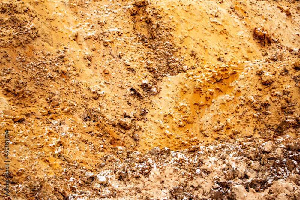 Textural sand, with relief surface, multi-colored layers and different ...