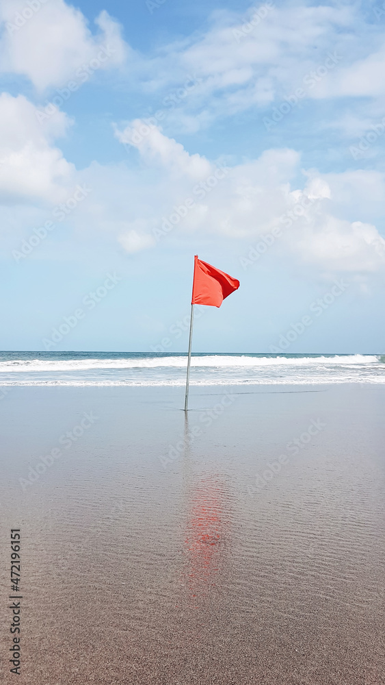 Safety by the Sea: Red Flag on a Pristine Beach Stock Photo | Adobe Stock
