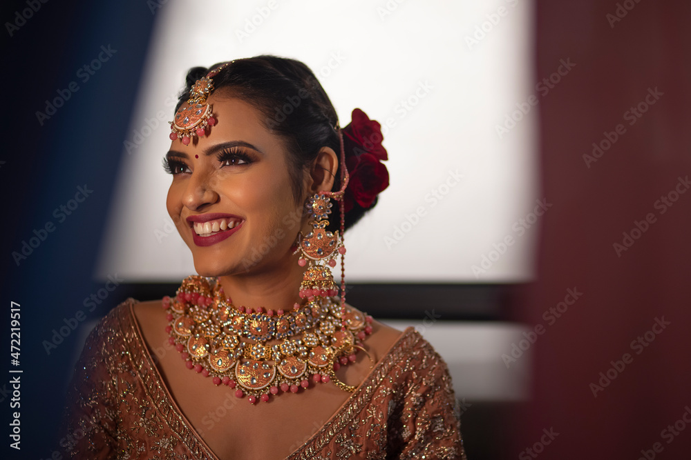 Beautiful Indian bride in traditional wedding outfit smiling Stock ...