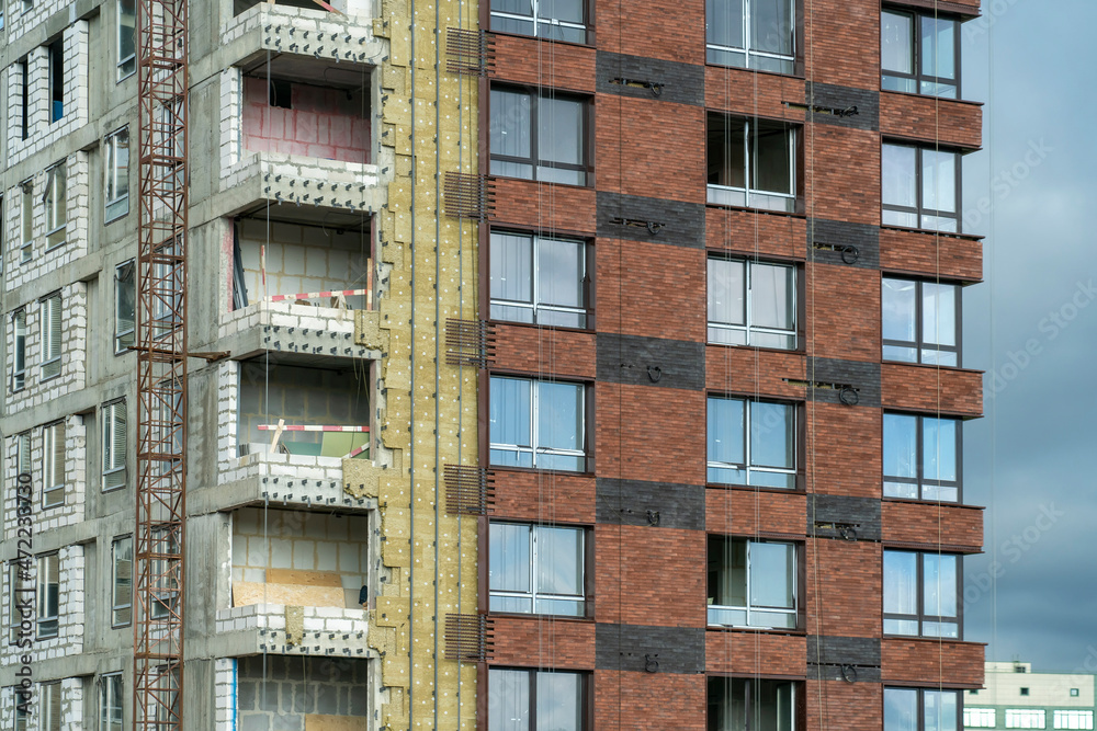 Monolithic concrete frame of apartment building under construction with ...