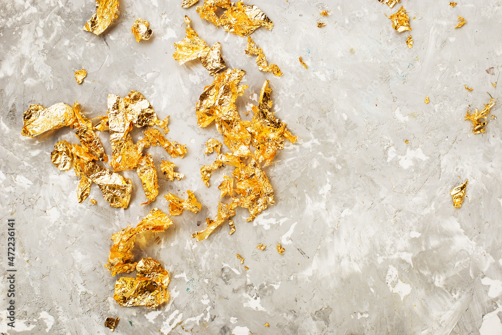 Luxurious golden background. Gold patal, precious flakes. The colors of ...