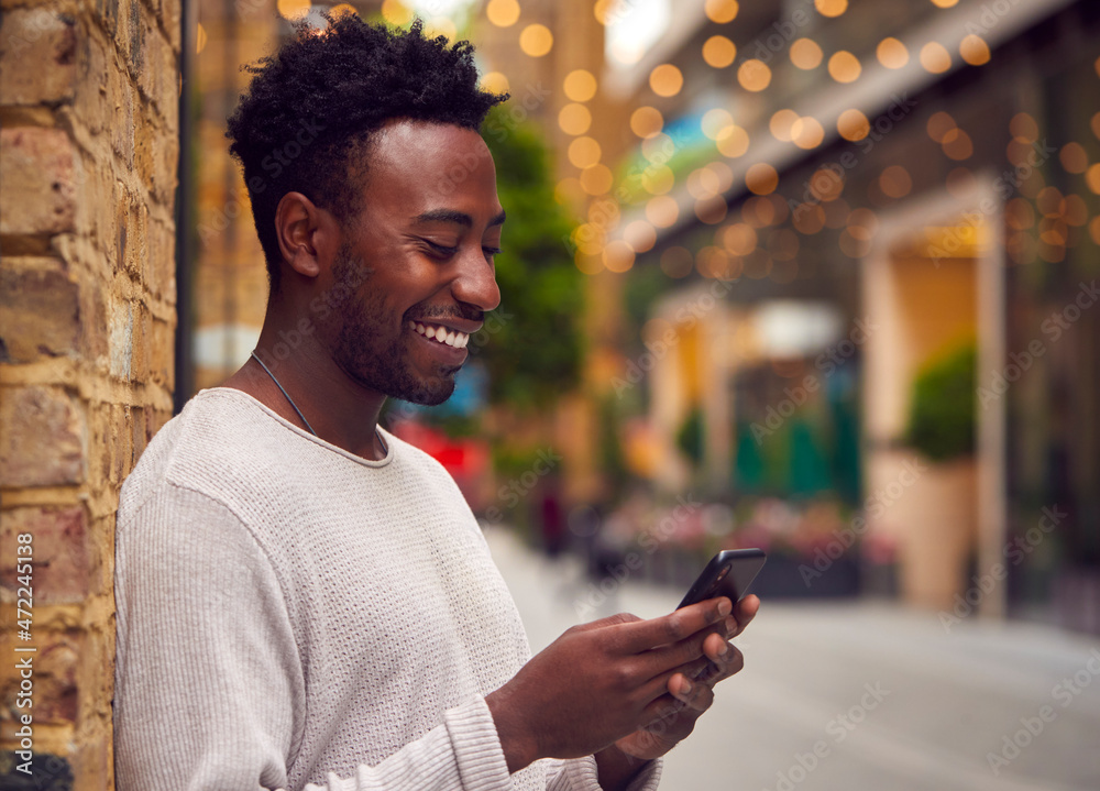 Male Vlogger Or Social Influencer In City Using Mobile Phone On Street ...
