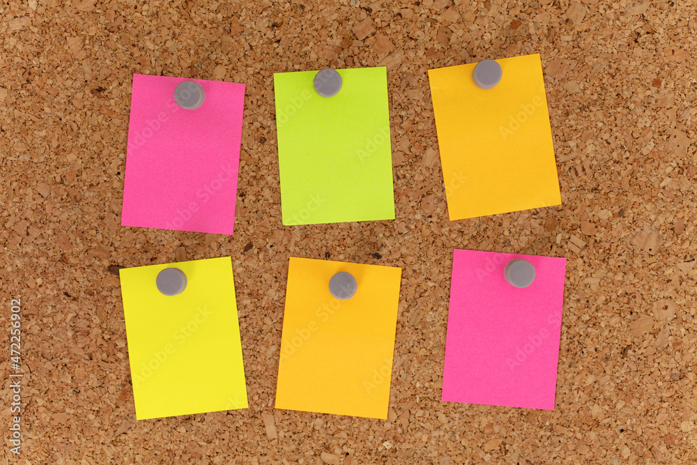 Blank colorful paper notepad reminder sticky notes on cork bulletin ...