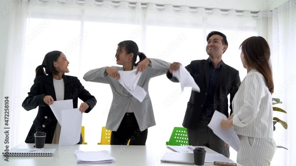 People throwing paper files around in conference room. business man and ...