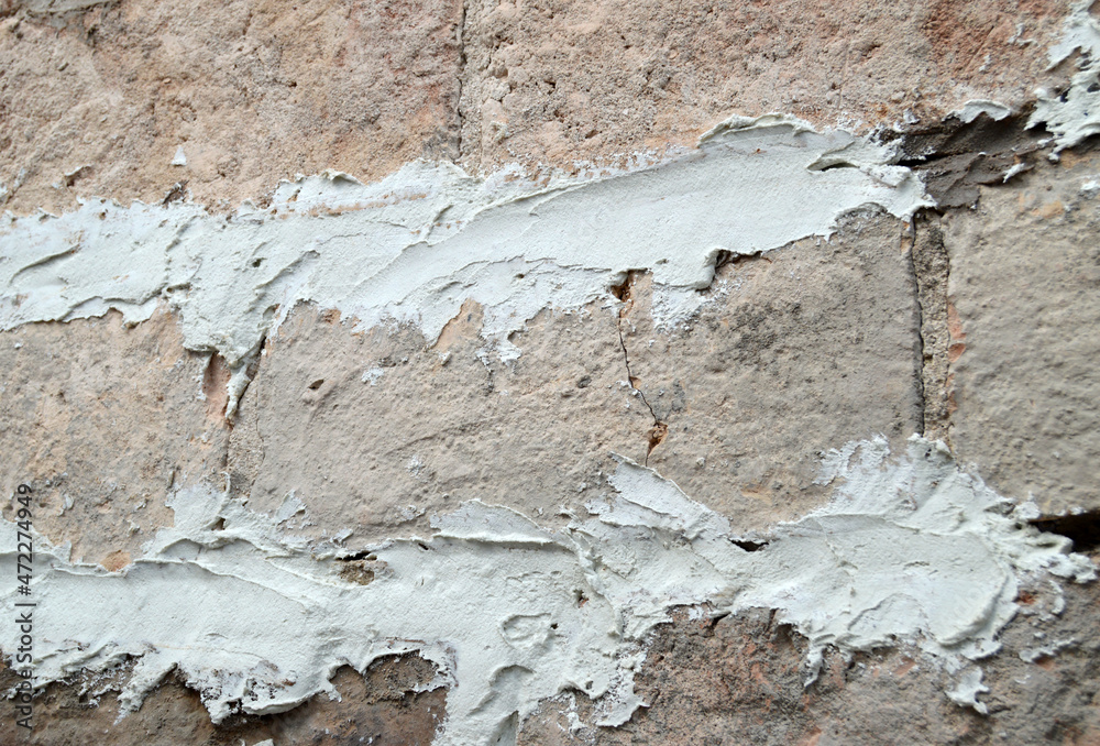 Patching an old dowel brick wall with lime mortar. Masonry work on a ...