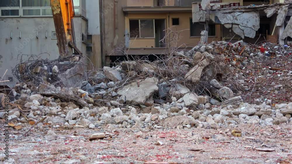 The Iron and Concrete of a Destroyed Building with the Help of an ...