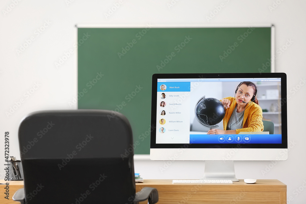 School teacher conducting lesson online Stock Photo | Adobe Stock