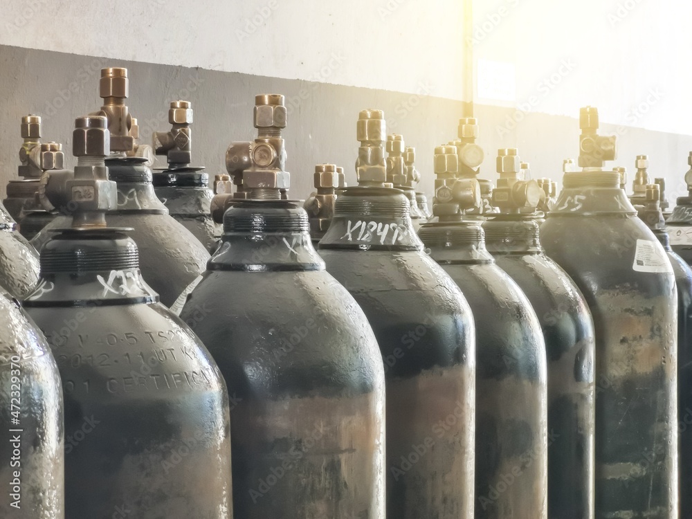 Group of oxygen cylinder tank with compressed gas for industrial use in ...