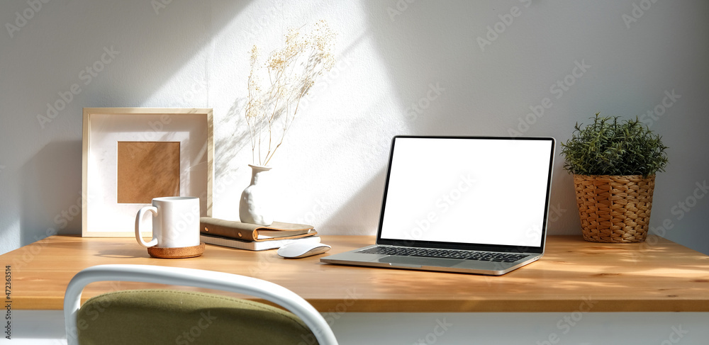 Modern workplace, computer laptop and supplies on wood table. Stock ...
