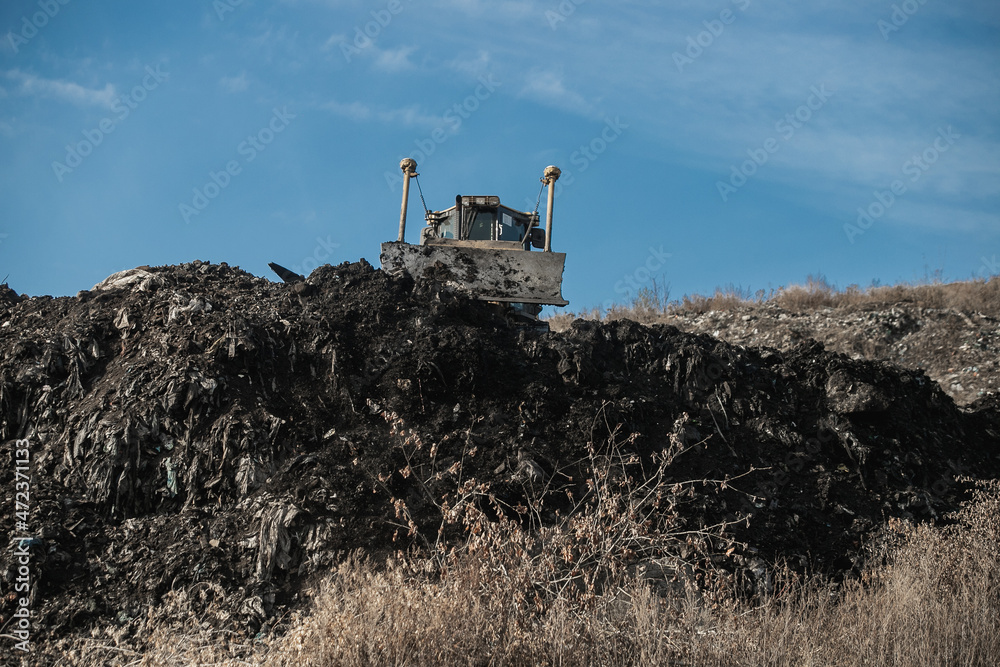 Recycling concrete and construction waste from demolition. Excavator at ...
