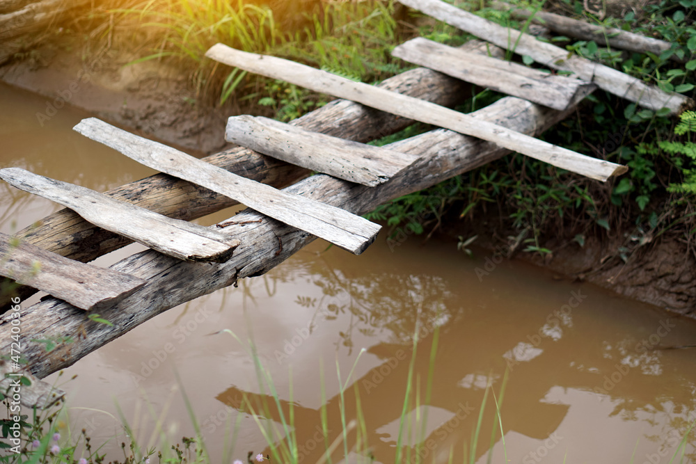 Wooden bridge crossing a small cannel in rural of Thailand. Thai ...