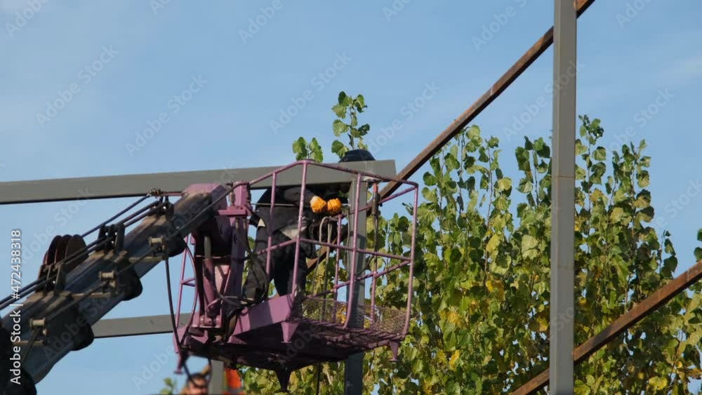 steel construction, worker tying wire rope in steel construction on ...