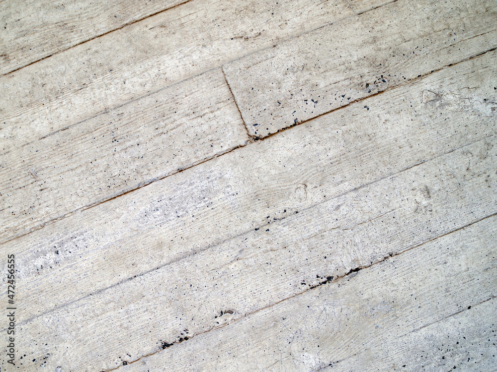 Concrete surface with diagonal joints. Background with wood texture ...