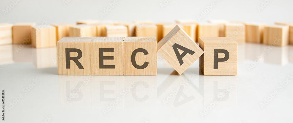 recap text on a wooden blocks, gray background. Photos | Adobe Stock
