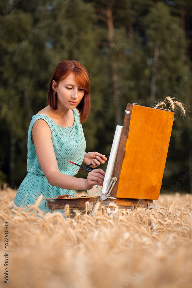 Front view of a beautiful artist girl full of inspiration, drawing a ...