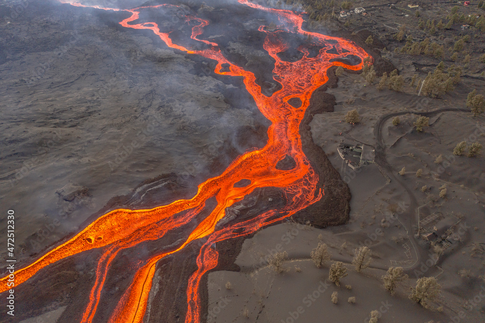 Aerial top down view of lava floating down the Volcan Cumbre Vieja, a ...