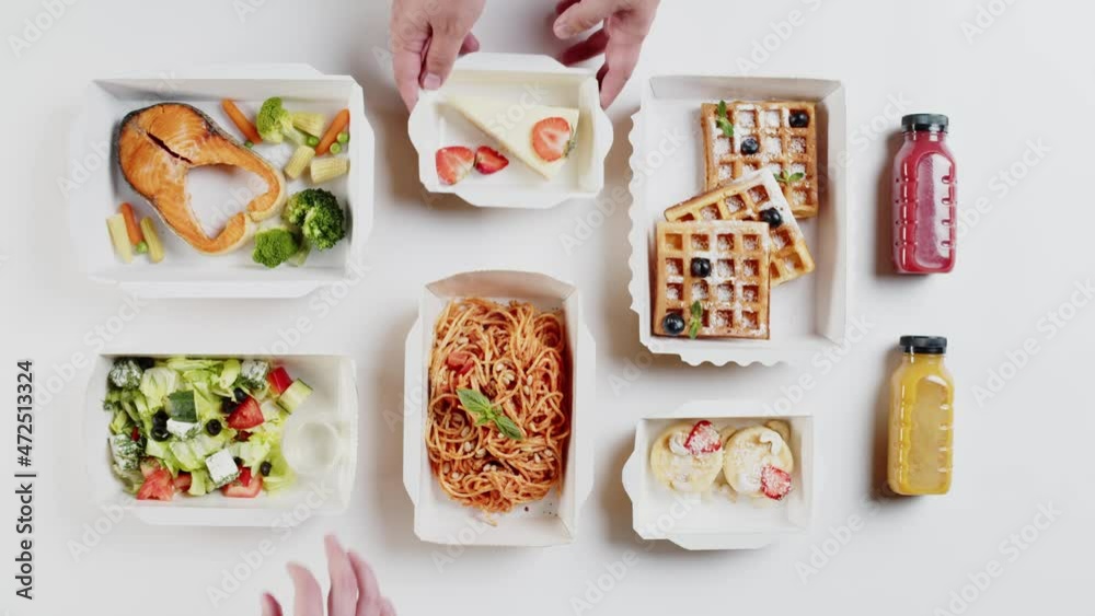 Food delivery top view. Lunch boxes with cooked salmon fish, spaghetti ...