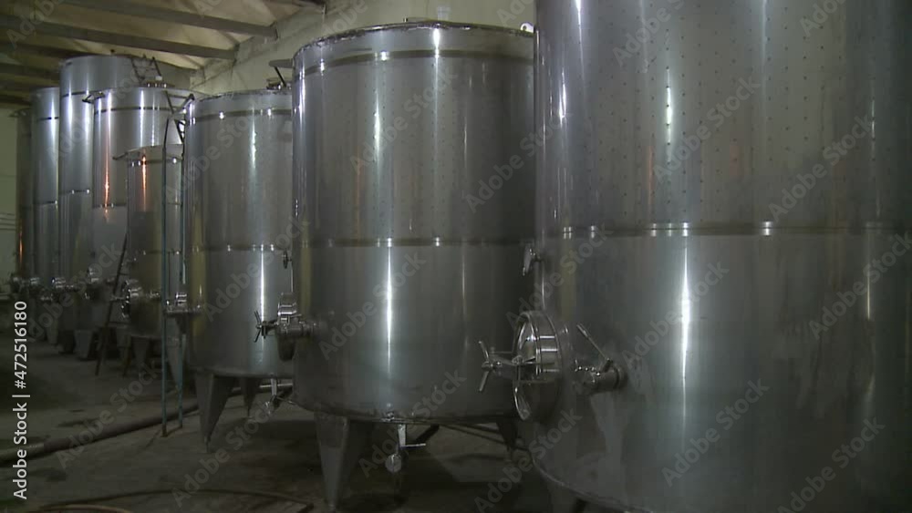 Large stainless steel wine distilling tanks. Silos for wine or beer ...