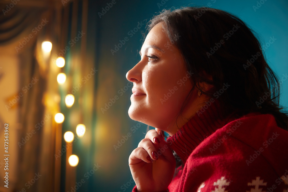 Fat plump chubby woman in red hot sweater in winter room before ...