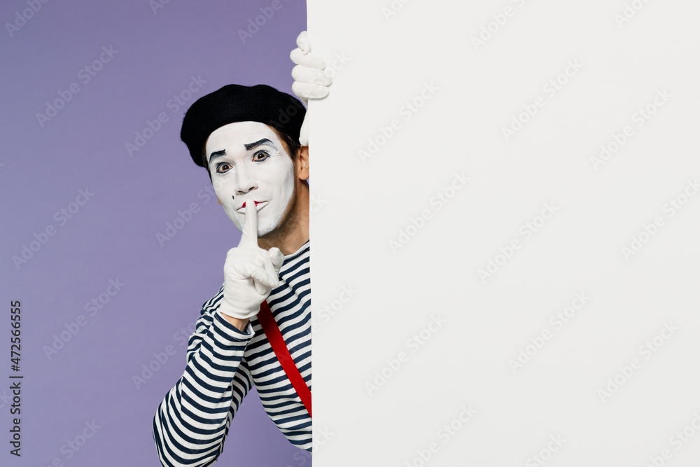 Young mime man with white face mask wears striped shirt beret look out ...